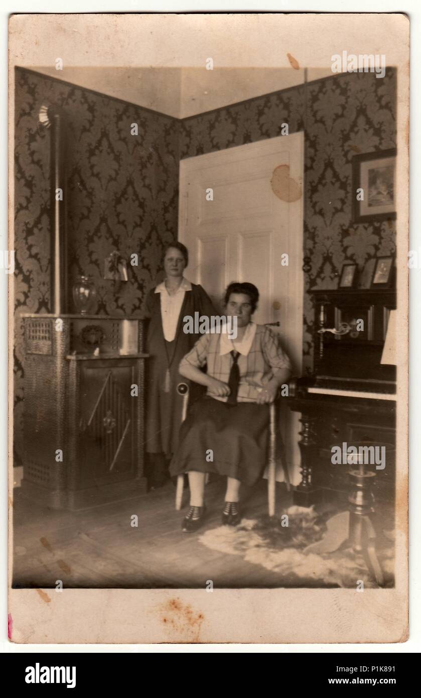 GERMANY - CIRCA 1930s: Vintage photo shows women pose at home. In the ...
