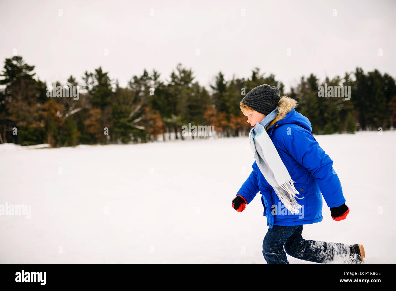Child running in snow hi-res stock photography and images - Alamy