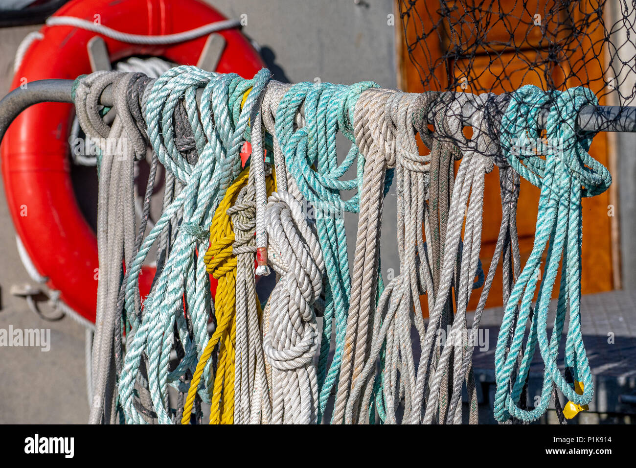 Ropes hanging on a fishing boat Stock Photo - Alamy