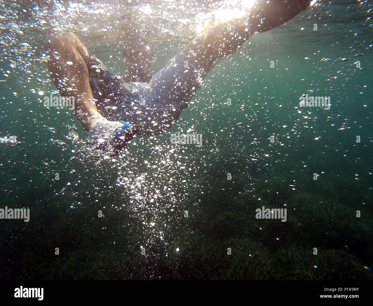 Legs underwater hi-res stock photography and images - Alamy