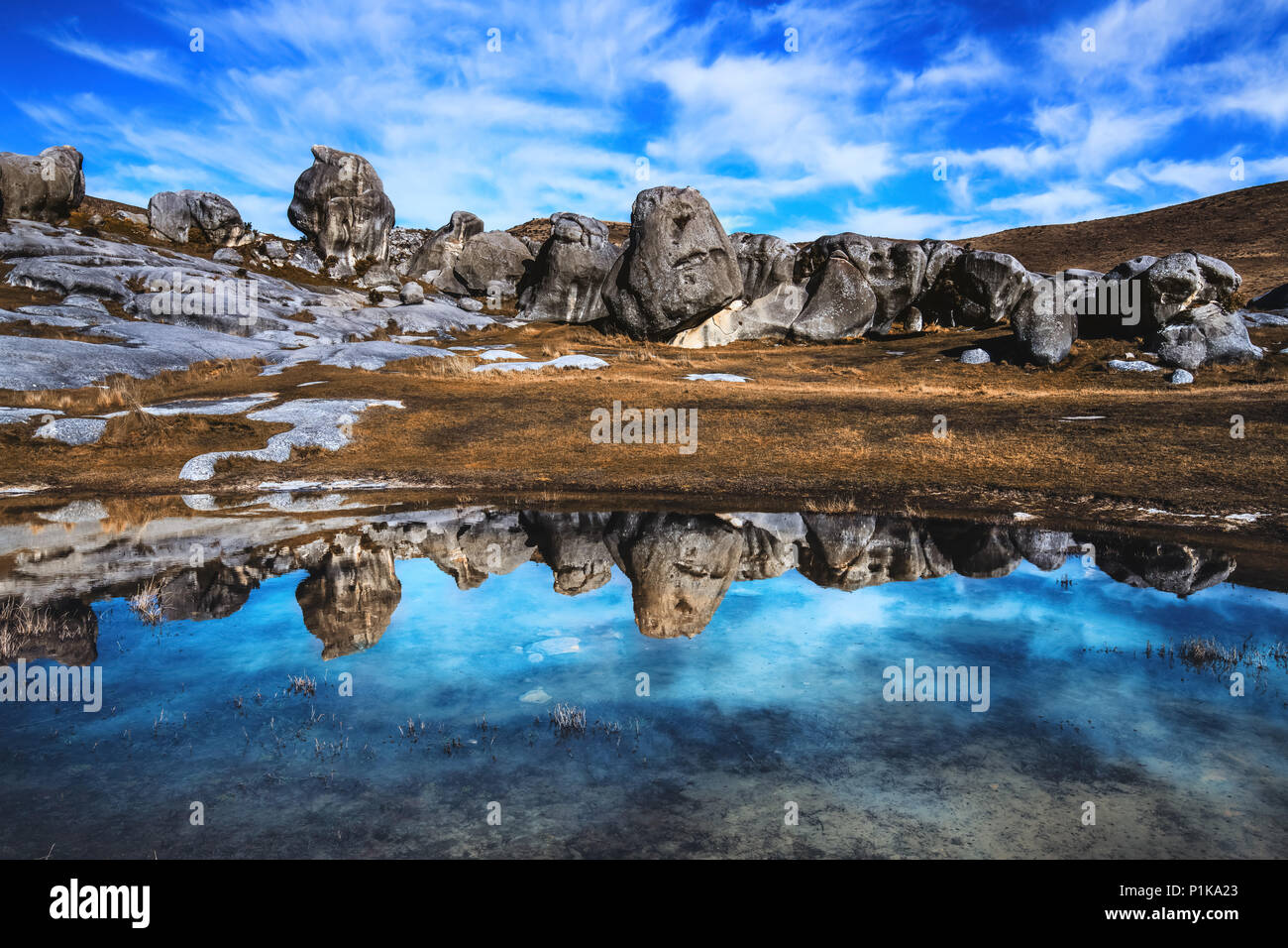 Rock reflections in a puddle of water, Castle Hill, South Island, New ...