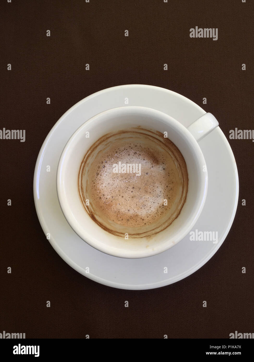 Overhead view of a half empty cup of coffee Stock Photo - Alamy