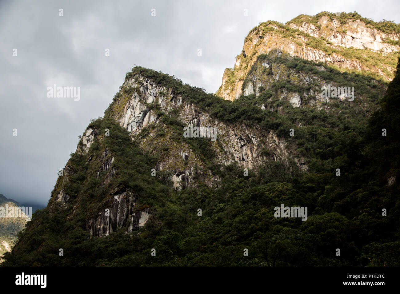 Triangular cliff faces exposed above Aguas Calientes on the road to ...