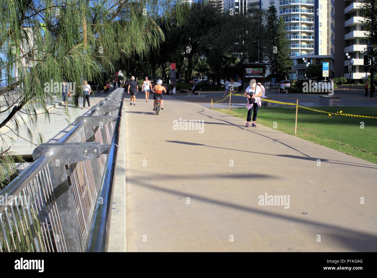 Busy beach scene. People at Surfer Paradise beach boulevard in Gold ...