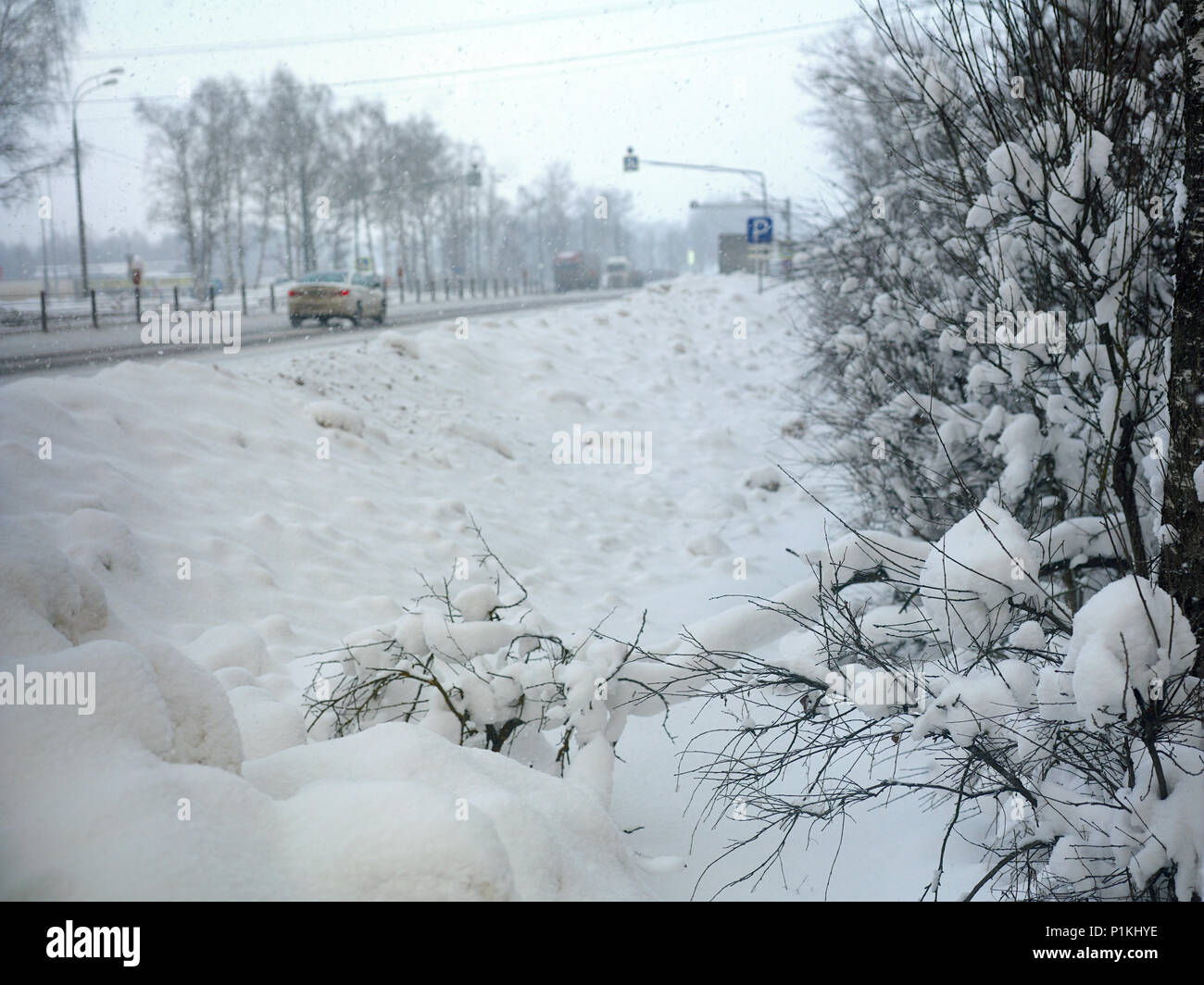 Traffic on a motorway under a massive snowfall, winter scene Stock ...
