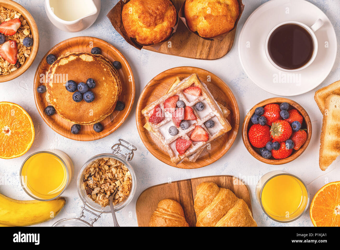 Delicious breakfast on a light table. Top view, copy space Stock Photo ...