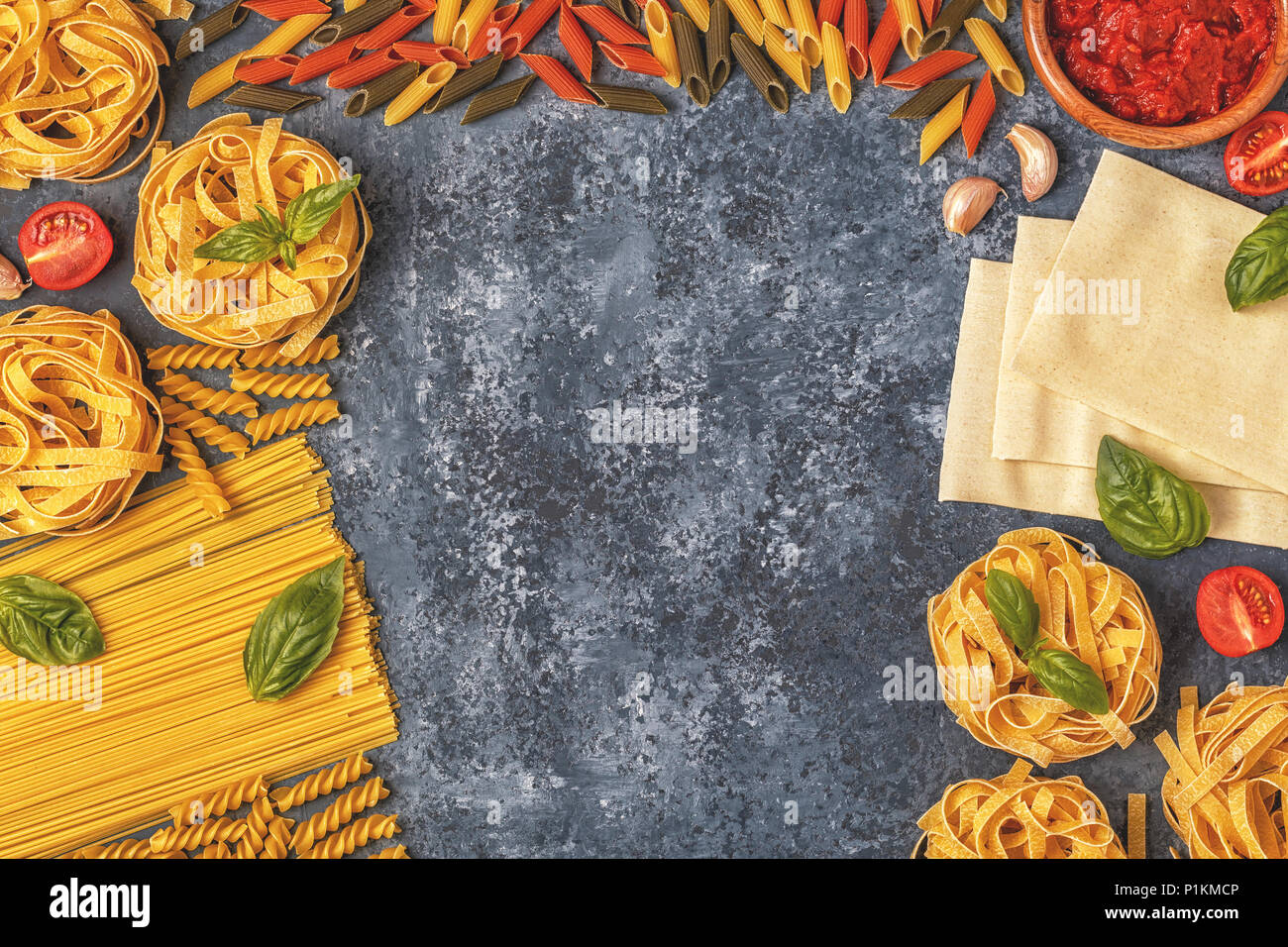 Italian food background with pasta, spices and vegetables. Top view ...