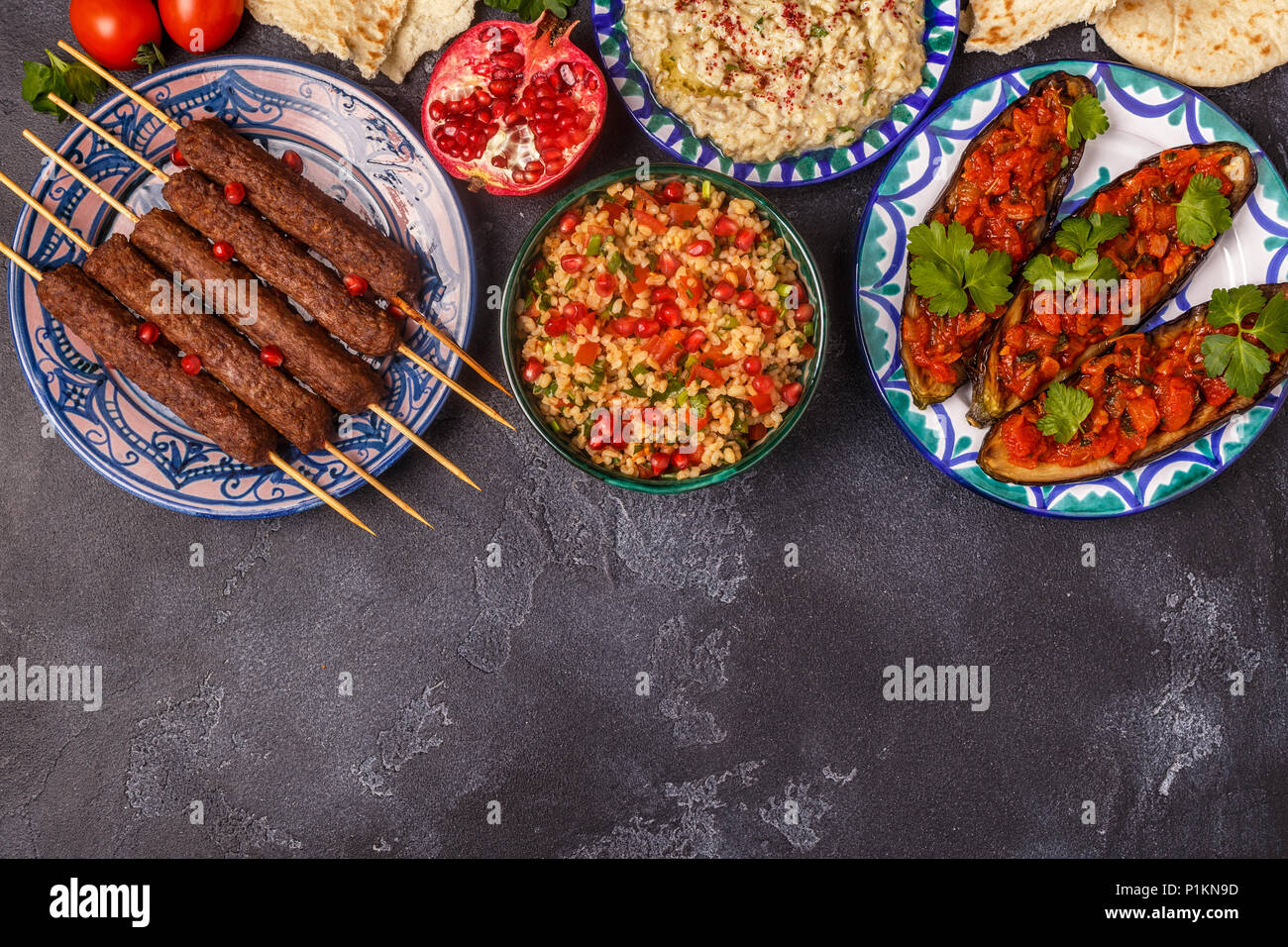 Classic kebabs, tabbouleh salad, baba ganush and baked eggplant with ...