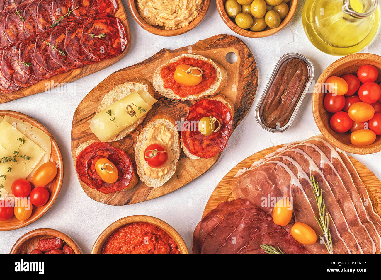 Typical spanish tapas concept. Concept include slices jamon, chorizo ...