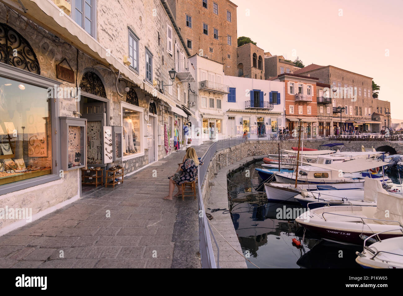 Hydra Town waterfront shops at sunset, Hydra Island, Greece Stock Photo ...