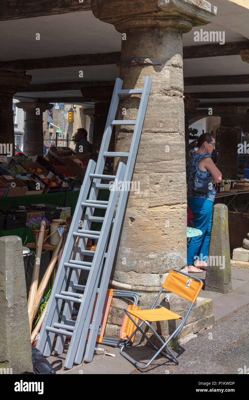 Wooden ladders lean against the Pillars of the 17 century Market Hall ...