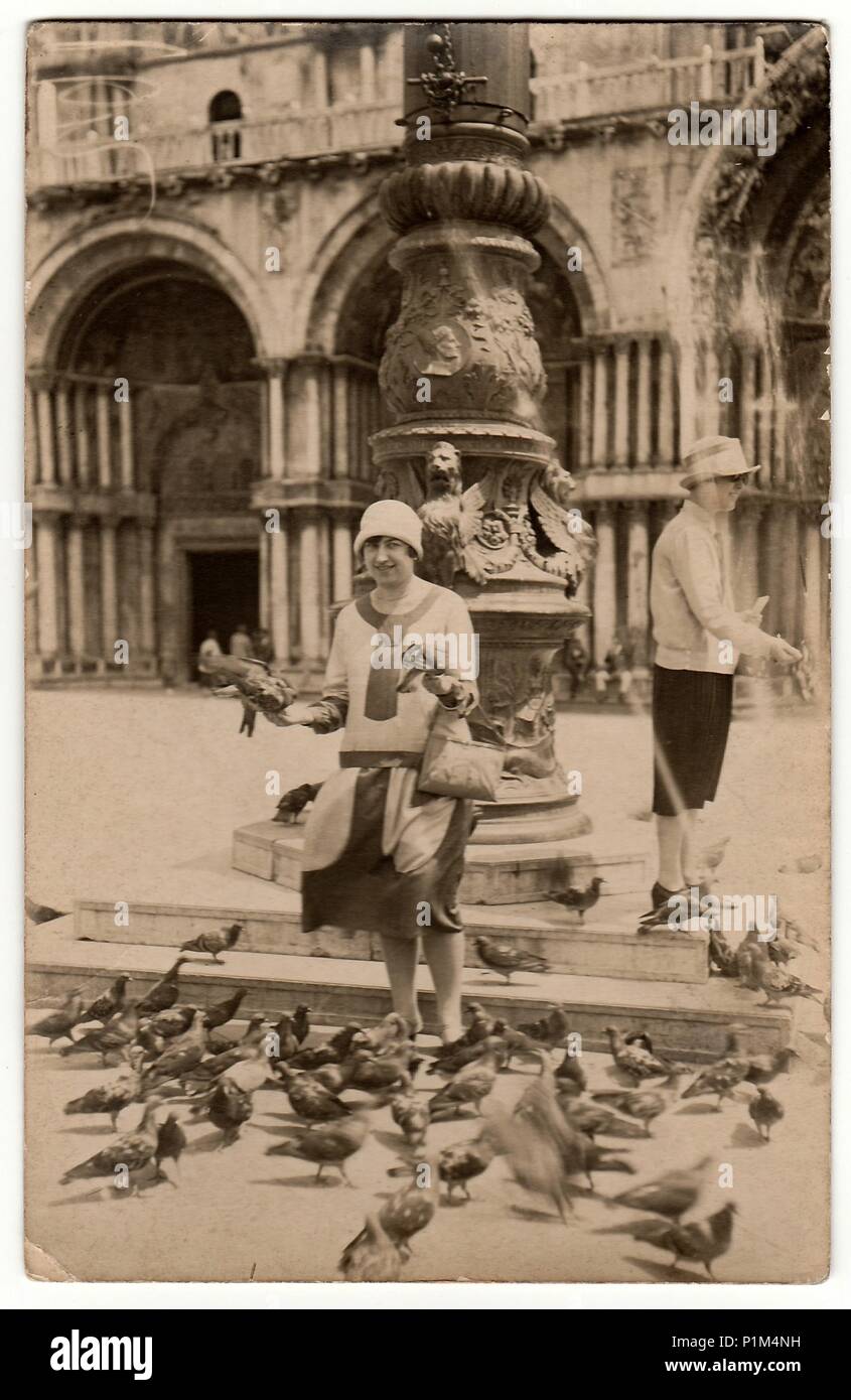 VENEZIA, ITALY - 1926: Vintage photo shows an elegant woman holds ...
