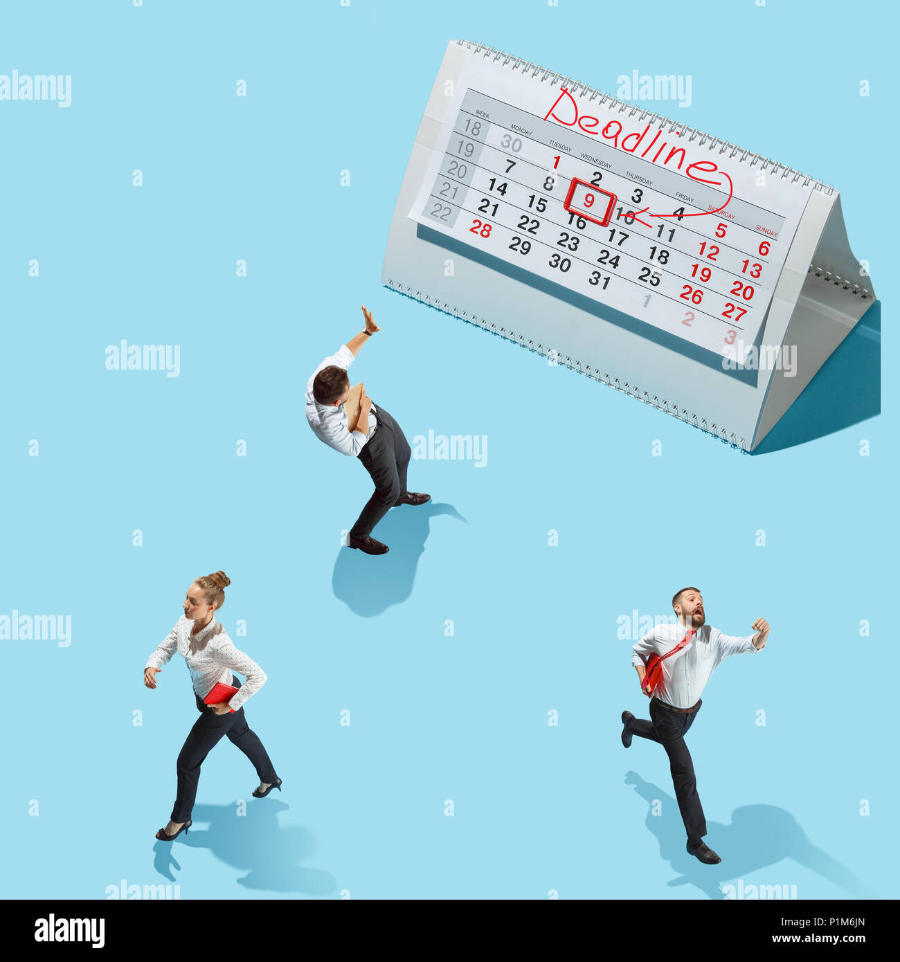 businessmen and woman are afraid of the symbol deadline Stock Photo - Alamy