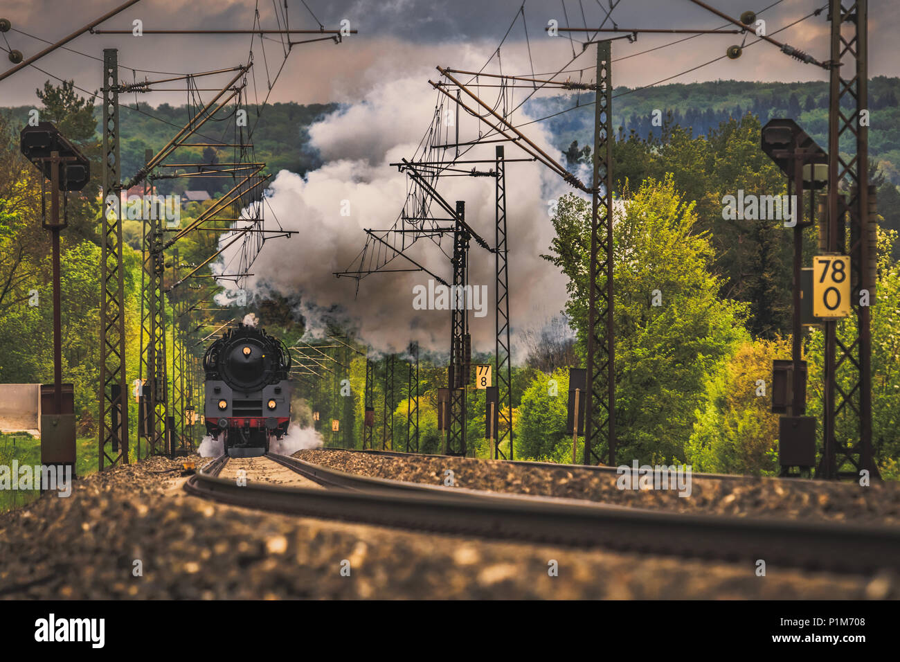 Steam locomotive at full throttle in the countryside Stock Photo - Alamy