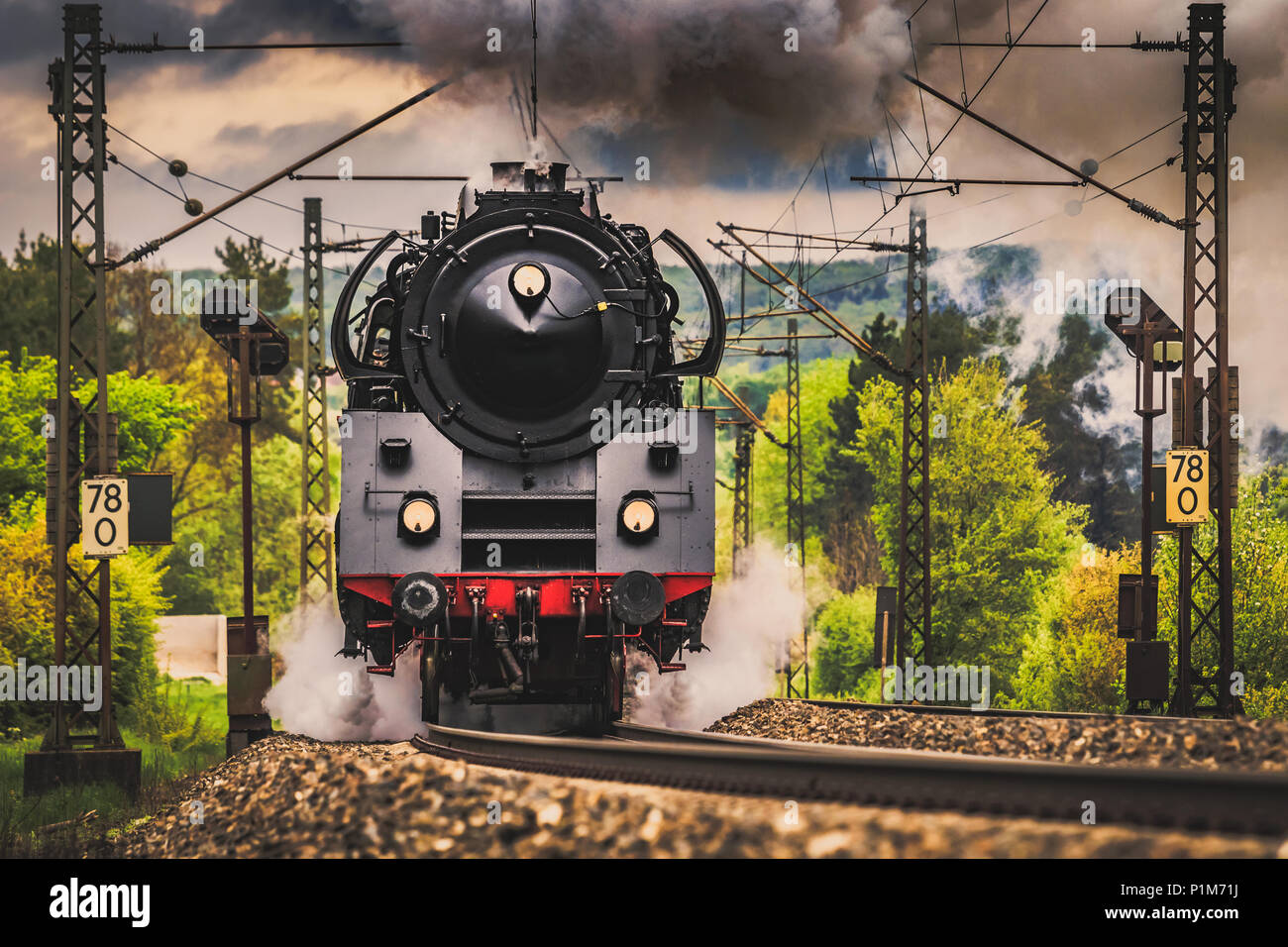 Steam locomotive at full throttle in the countryside Stock Photo - Alamy