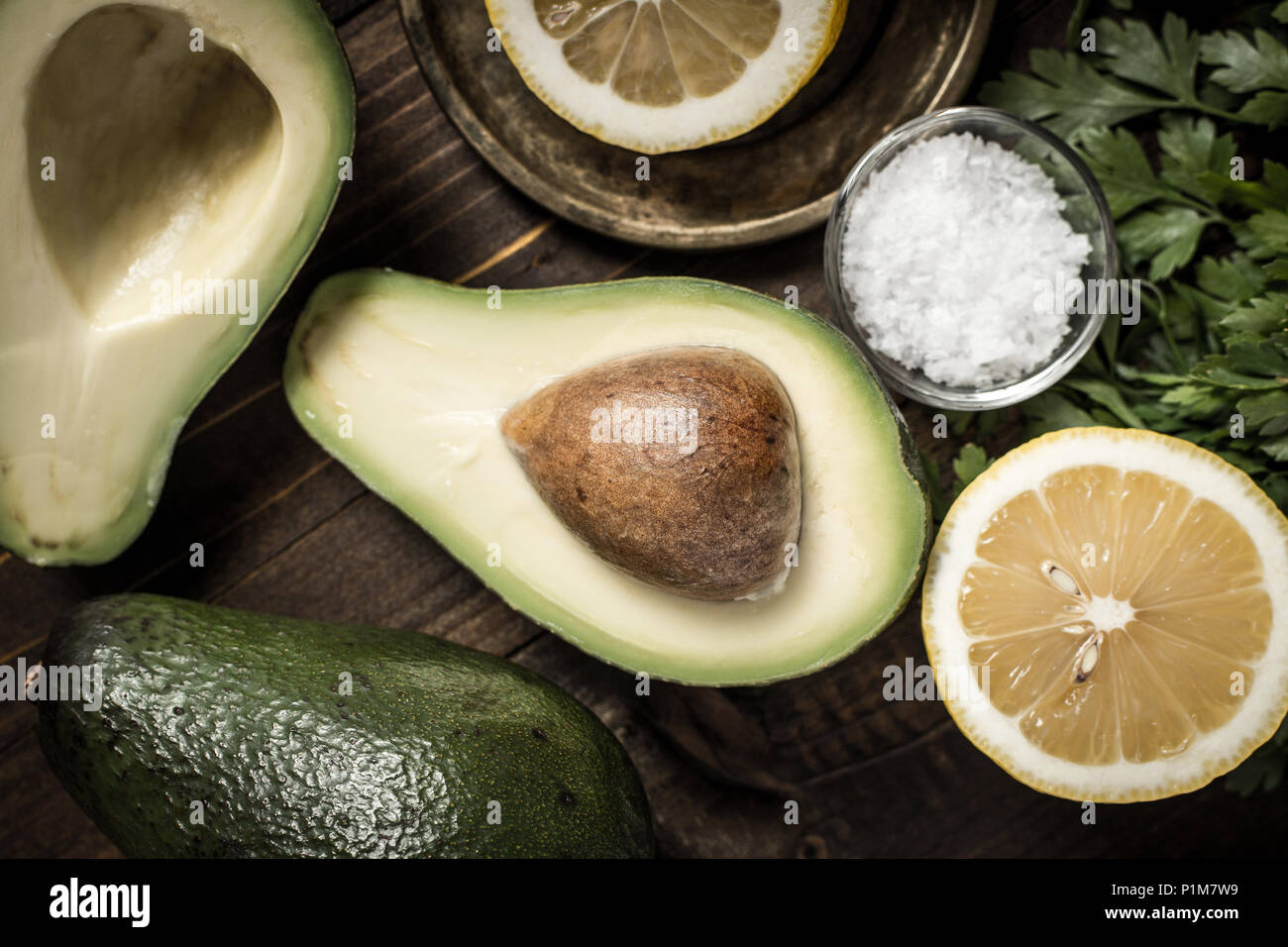 Avocado on Dark Wooden Background as Healthy Food Concept Stock Photo ...