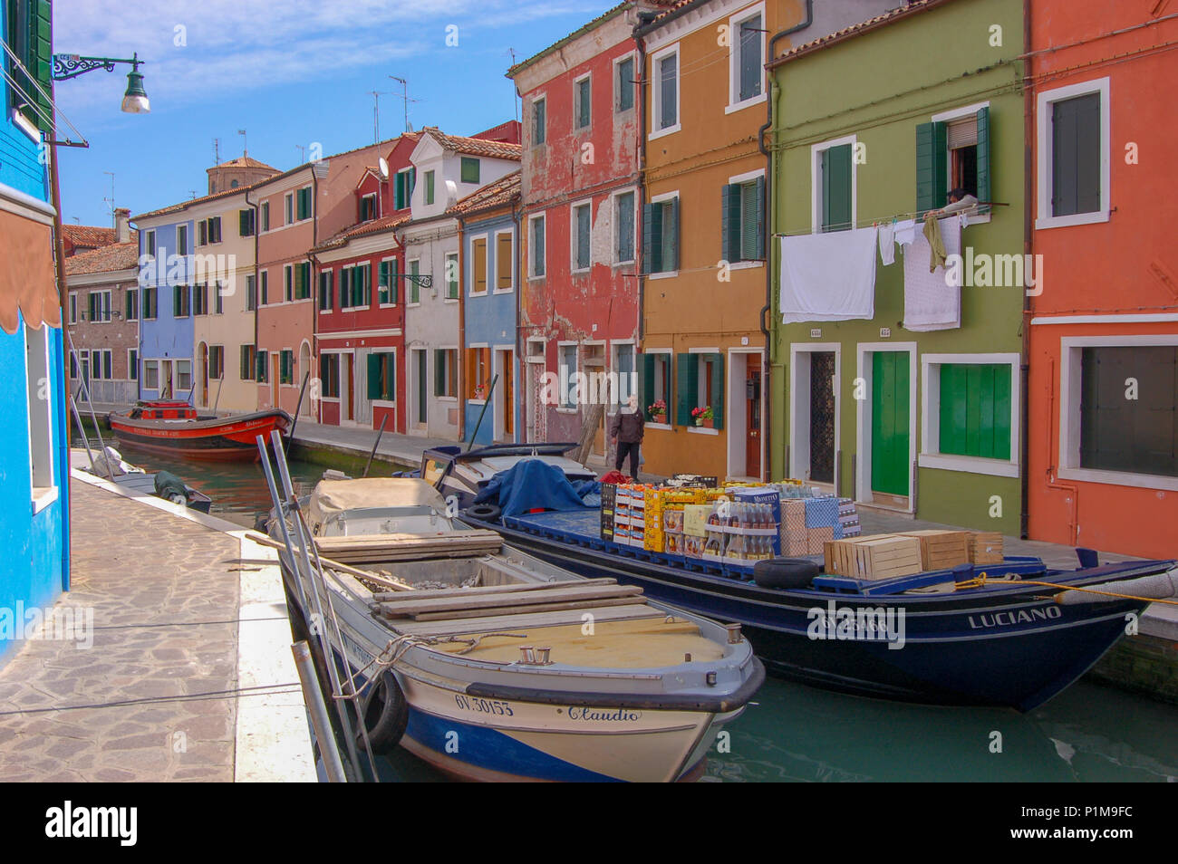 Colourful houses and bustling and busy canals on the fishing village of Burano in the Venice ...