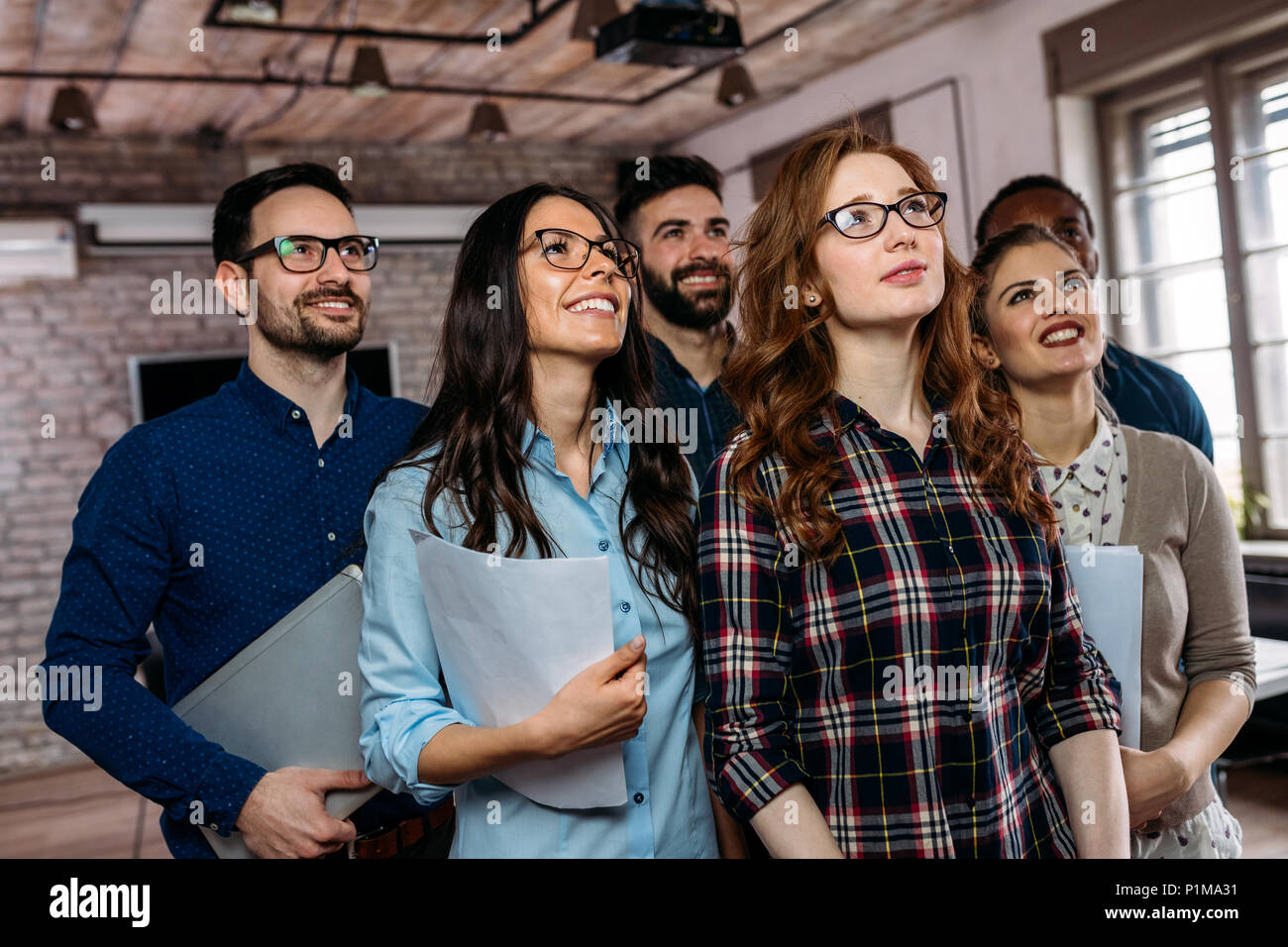 Portrait group office workers smiling hi-res stock photography and ...
