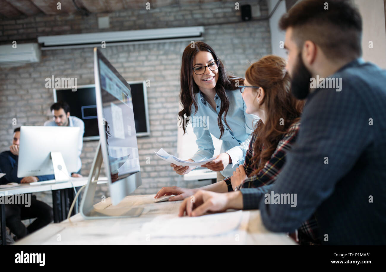 Young architects working on project in office Stock Photo - Alamy