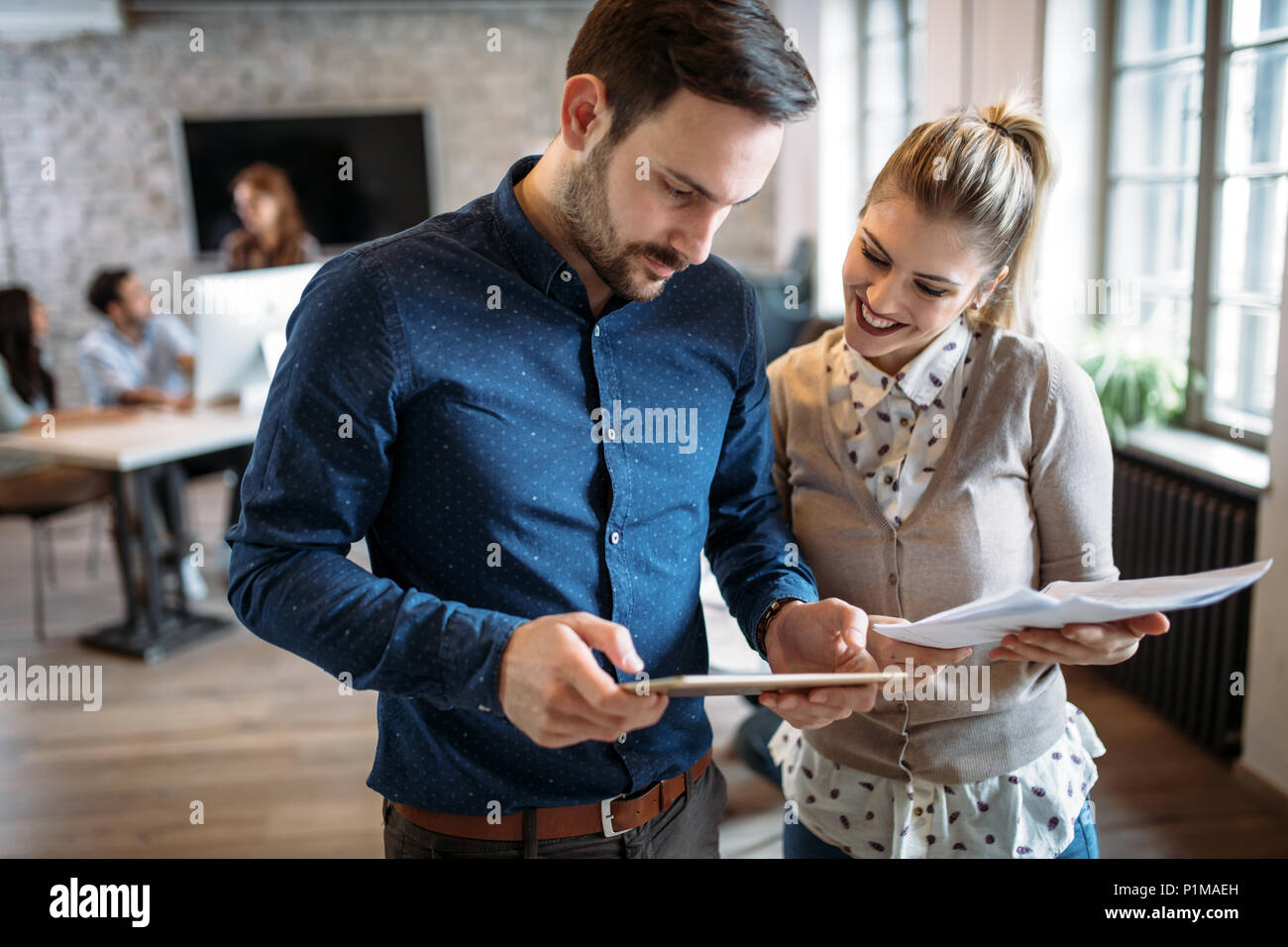 Portrait of architects having discussion in office Stock Photo - Alamy