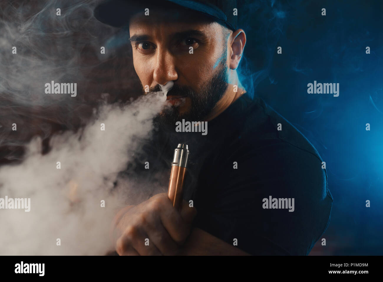 Man vaping an electronic cigarette Stock Photo - Alamy
