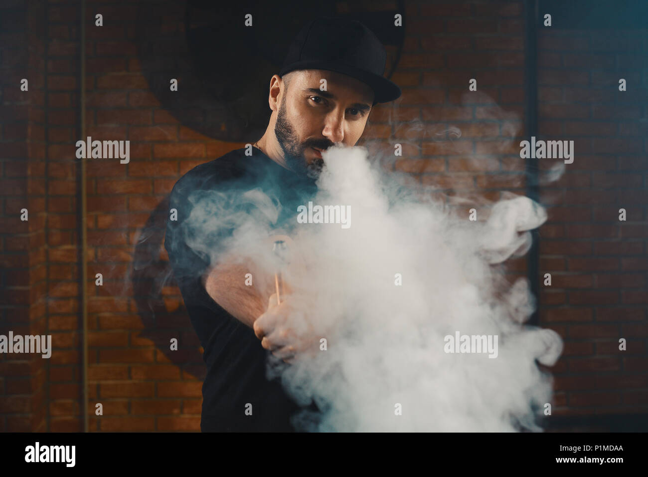 Man vaping an electronic cigarette Stock Photo - Alamy