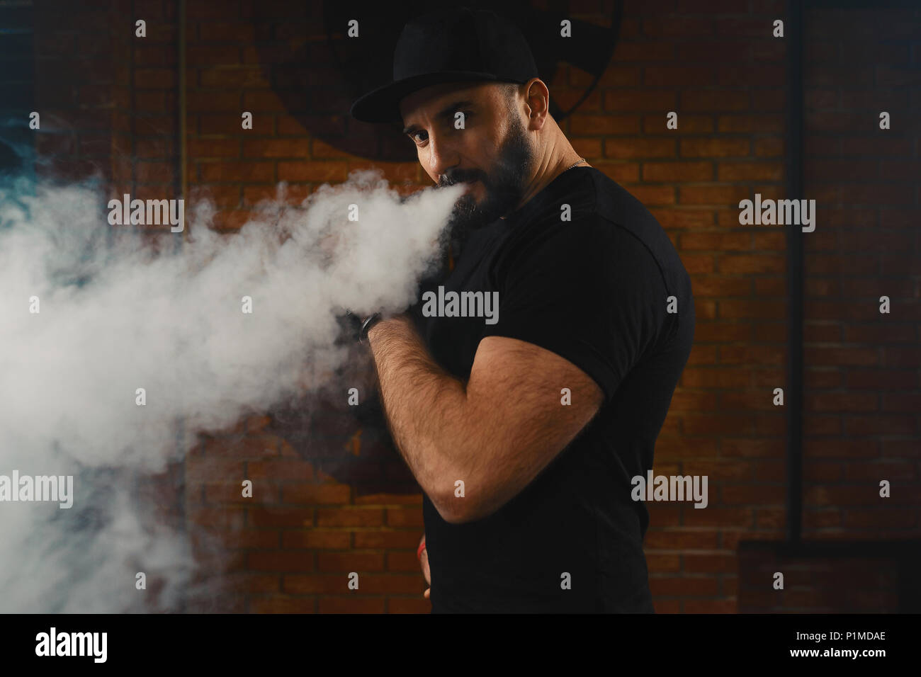 Man vaping an electronic cigarette Stock Photo - Alamy