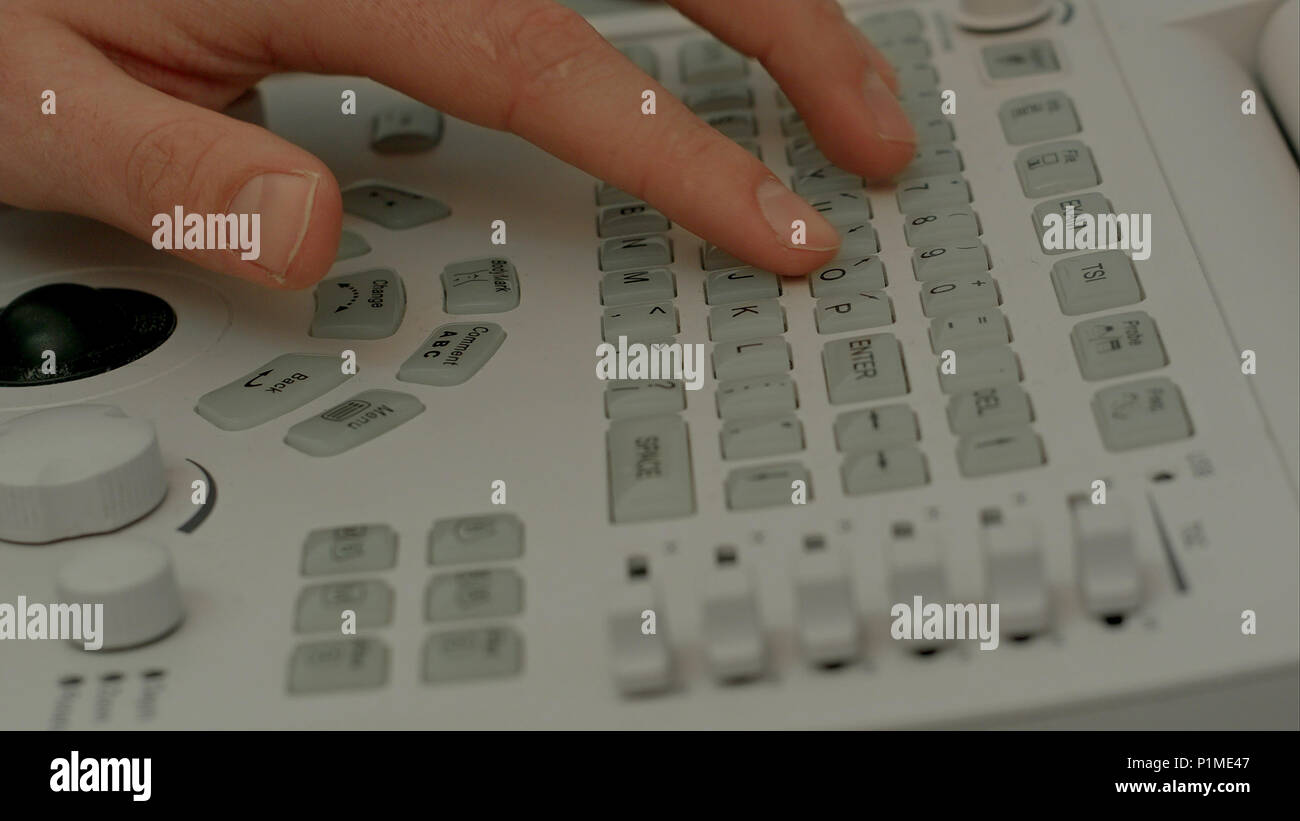 Control panel of medical device with doctor's hand Stock Photo - Alamy