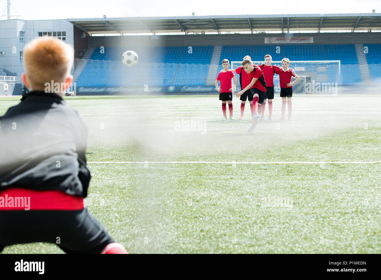 Boy scoring goal hi-res stock photography and images - Alamy