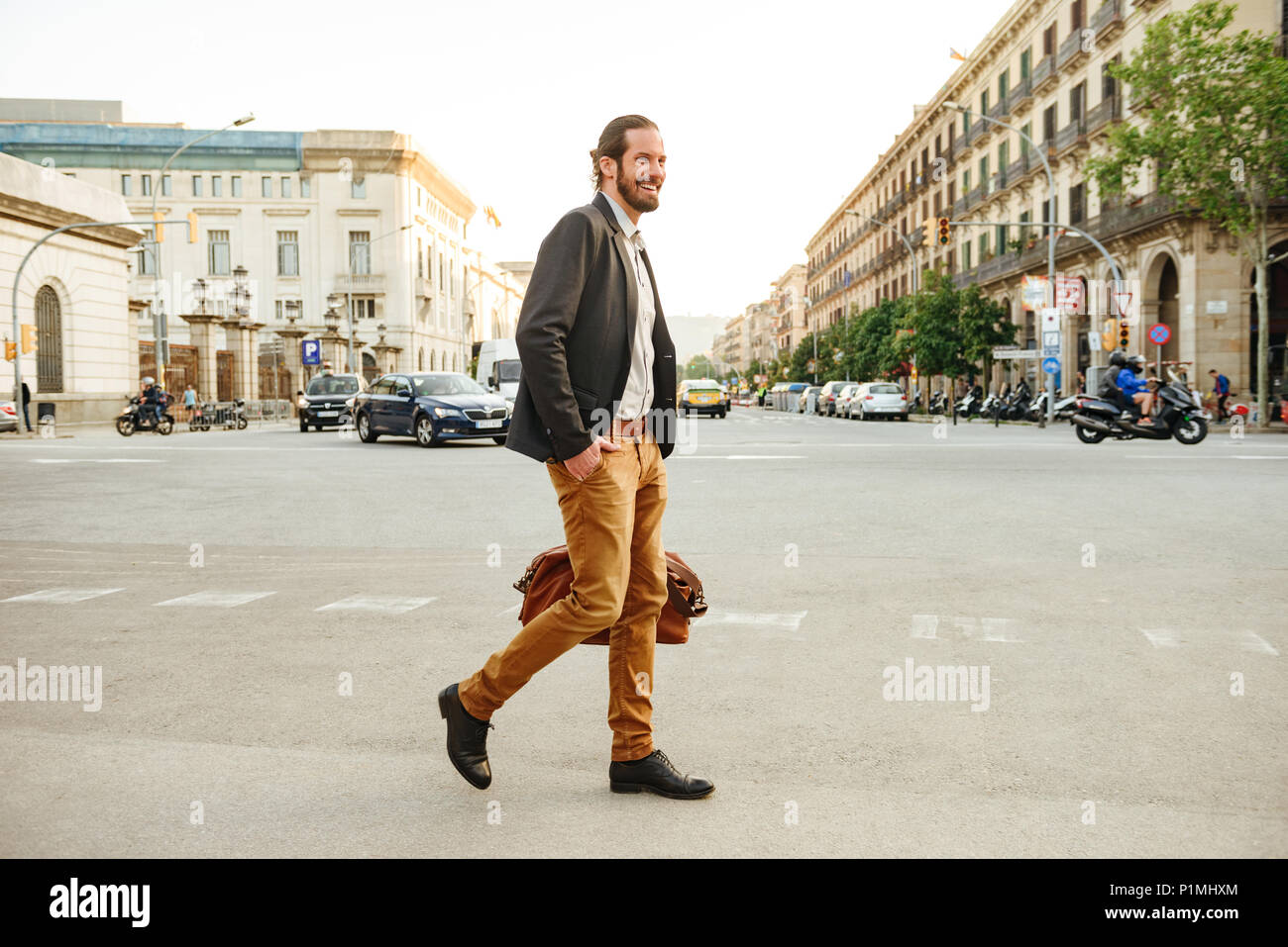 Portrait of modern elegant man in stylish clothing laughing while ...