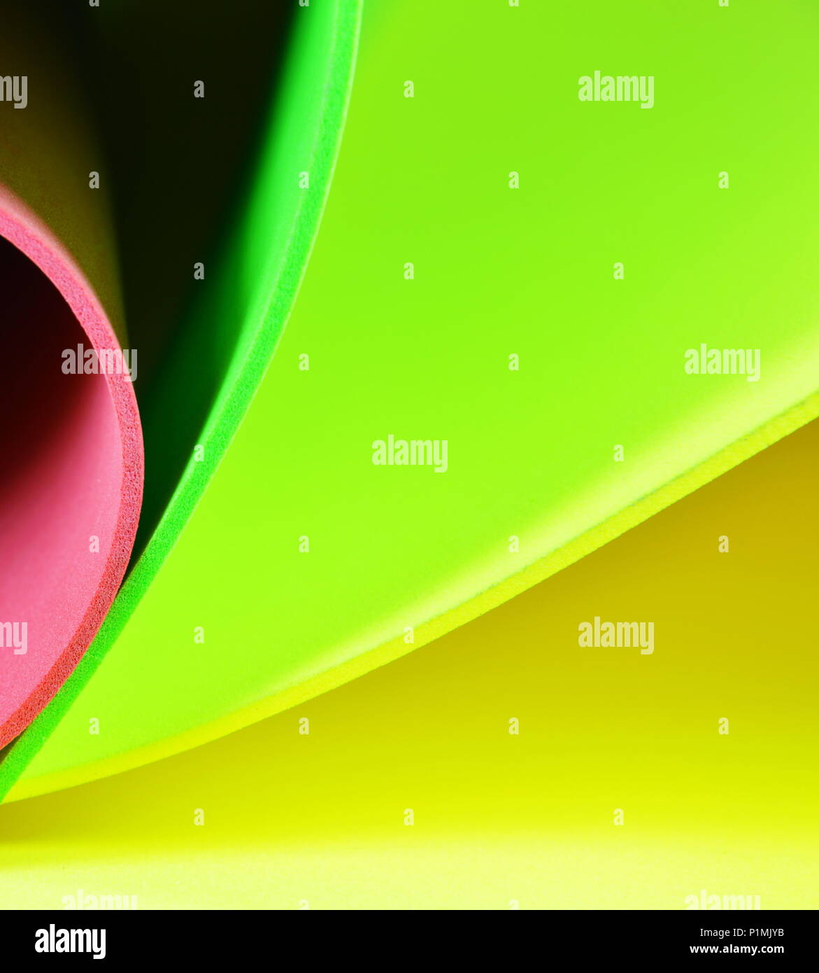 curve of color foam rubber board roll Stock Photo - Alamy