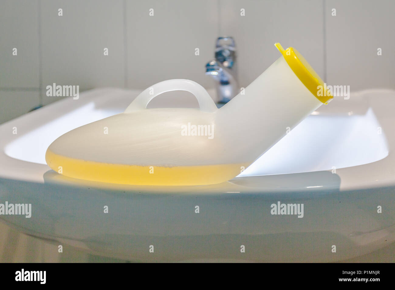 Plastic cylinder To keep the urine of the patient in hospital To be ...