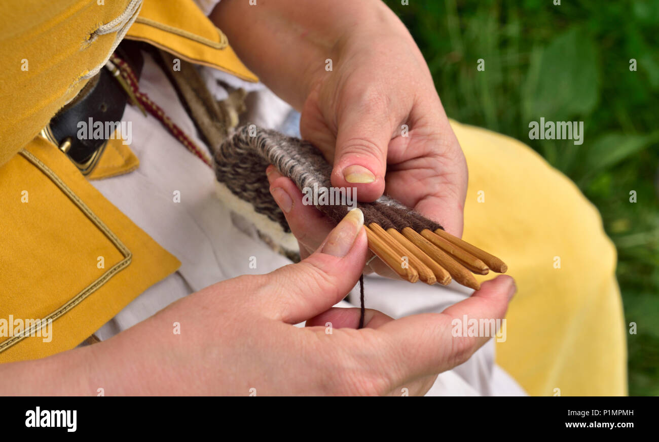 Hand weaving using weaving sticks Stock Photo - Alamy