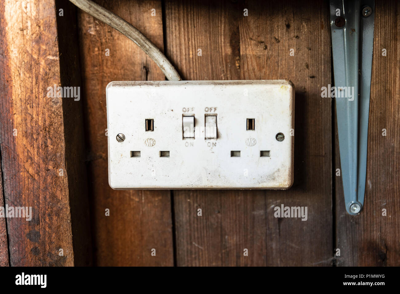 Very old electricity plug sockets in an old shed Stock Photo - Alamy