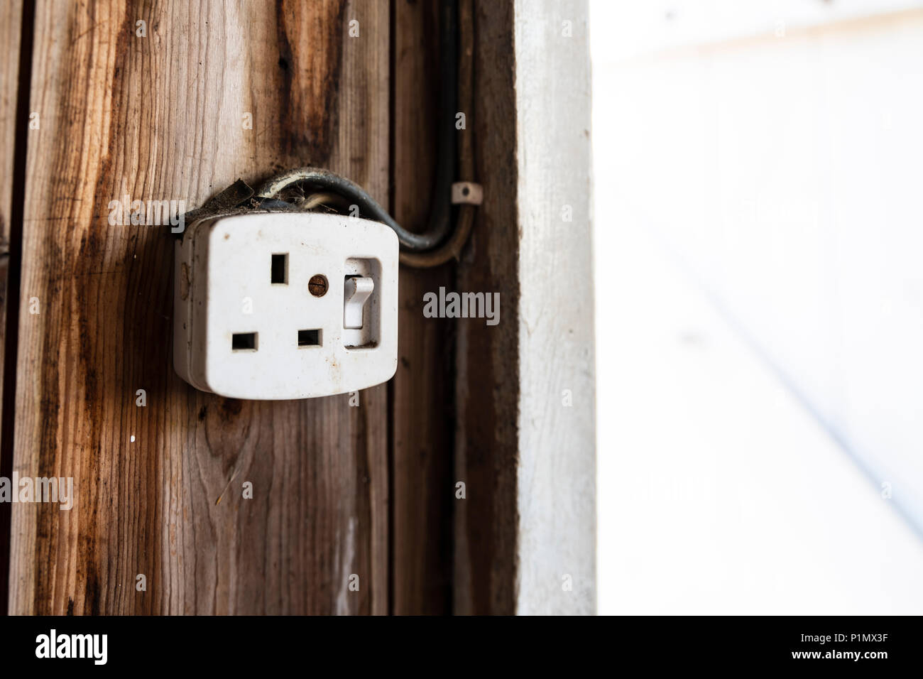Very old electricity plug sockets in an old shed Stock Photo - Alamy