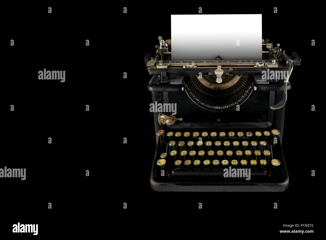 Old typewriter on black background Stock Photo - Alamy