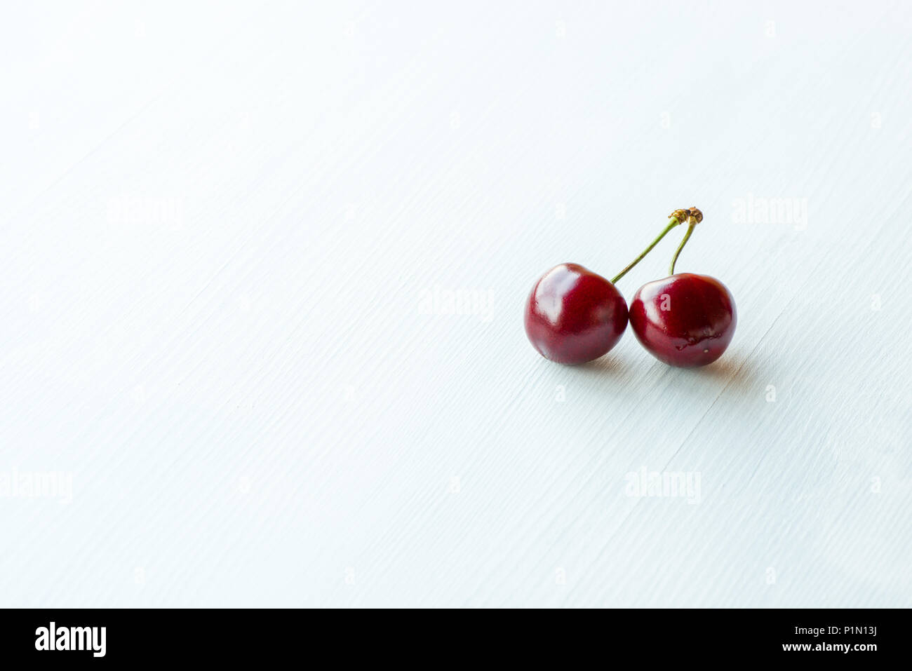Cherries isolated on white background Stock Photo - Alamy