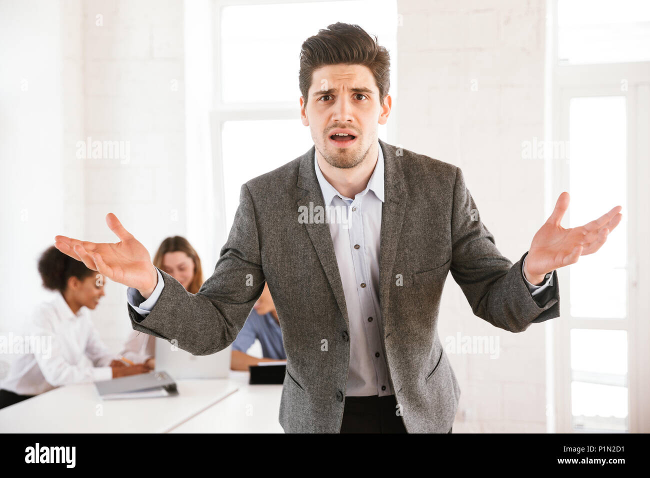 Confused businessman confident women hi-res stock photography and ...
