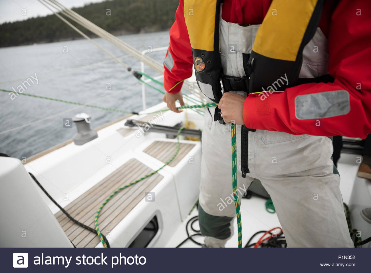 Woman standing holding rope hi-res stock photography and images - Alamy