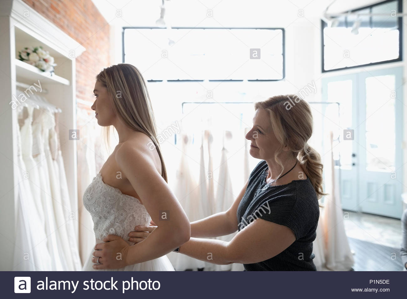 Wedding dress fitting hi-res stock photography and images - Alamy