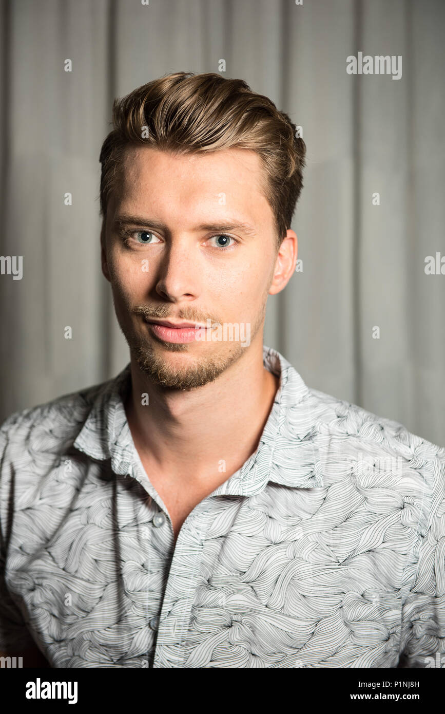 Handsome young man blond hair and blue eyes hi-res stock photography ...