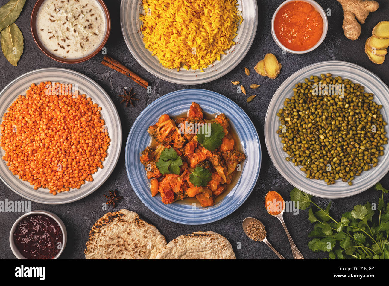 Traditional Indian curry with rice, lentils and mung beans. Top view ...