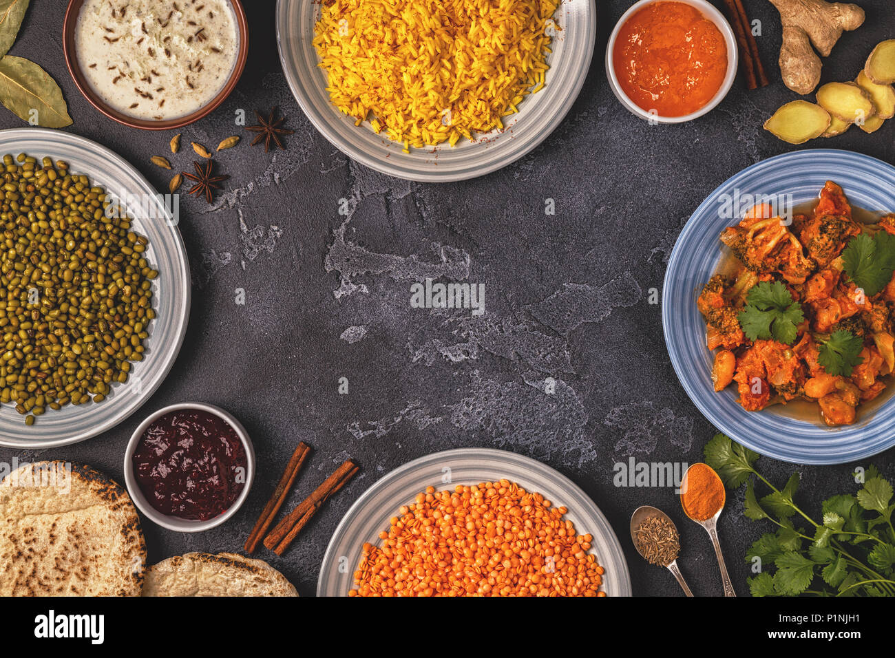Traditional Indian curry with rice, lentils and mung beans. Top view ...