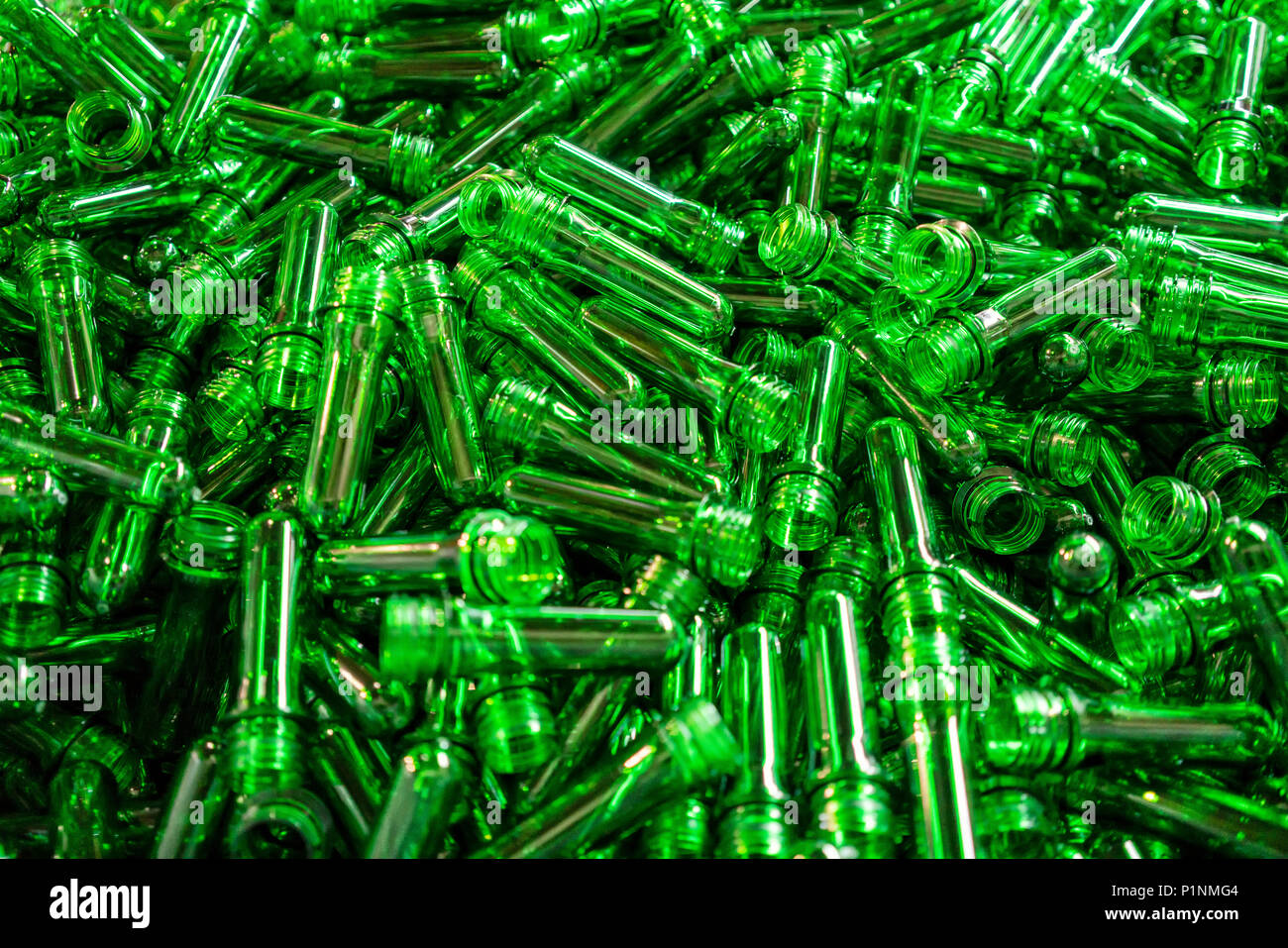 green plastic tubes that will be future beverage bottles Stock Photo ...