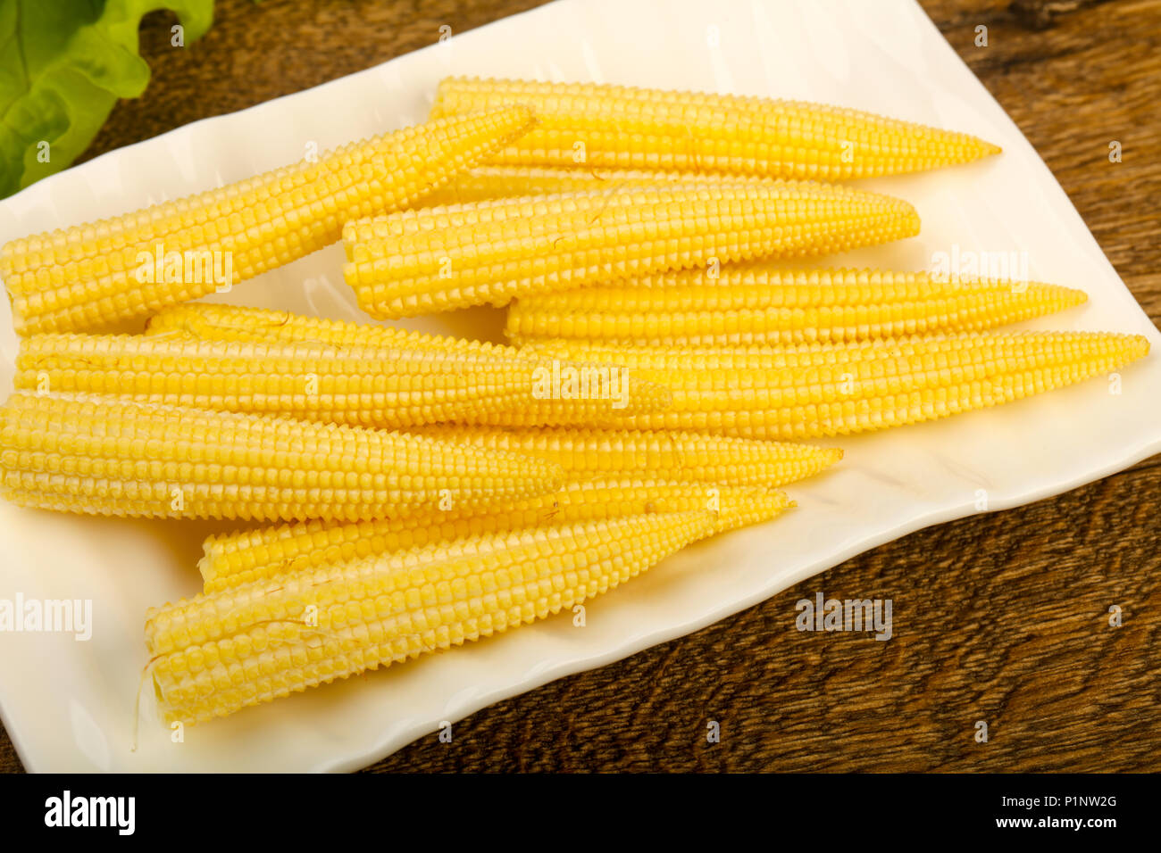 Young raw baby corn Stock Photo - Alamy
