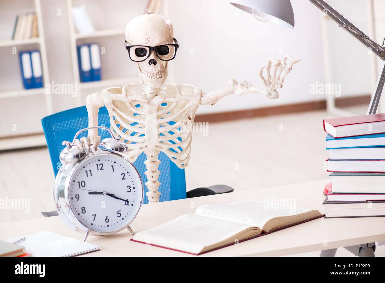 Skeleton businessman working in the office Stock Photo - Alamy