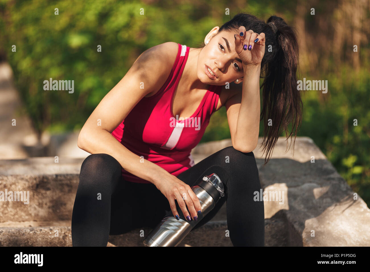 Tired girl sitting on steps hi-res stock photography and images - Alamy