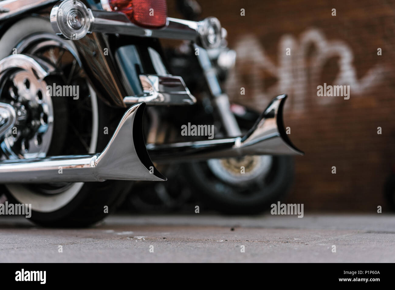 Shiny chromed retro fishtail exhausted pipes of luxury motorcycle ...