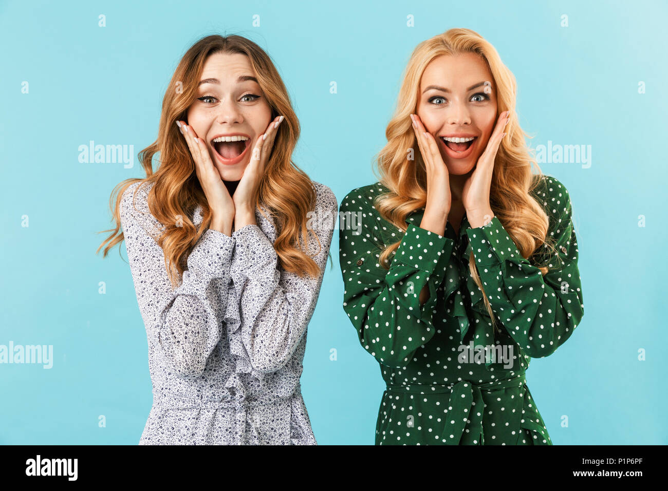 Two surprised beautiful women open hi-res stock photography and images ...
