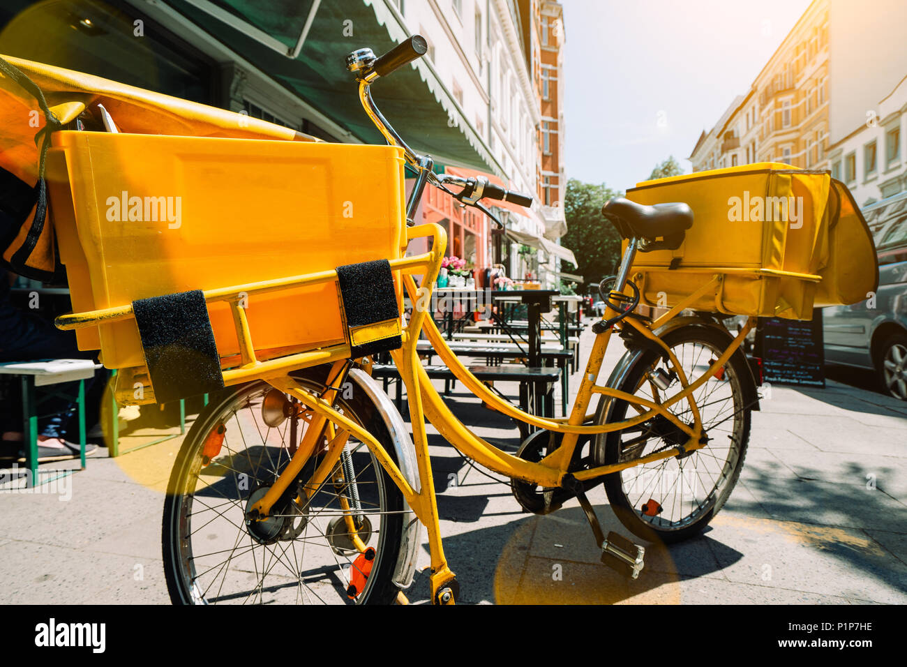 Yellow post bicycle made stop near building for delivery. Hamburg ...